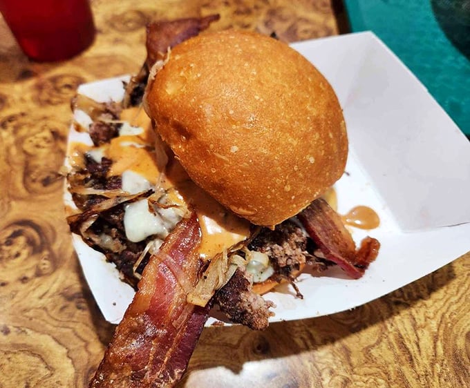 This isn't just a burger—it's architecture with bacon flying buttresses and a golden-domed bun cathedral.