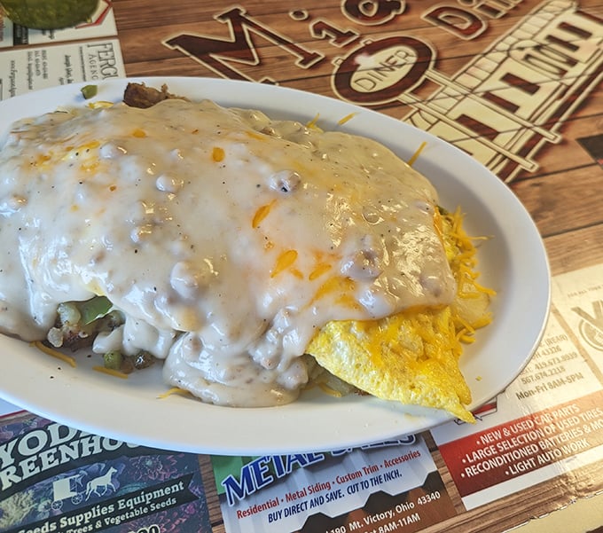 This omelet didn't just get covered in sausage gravy—it got smothered with the kind of affection only small-town diners truly understand.