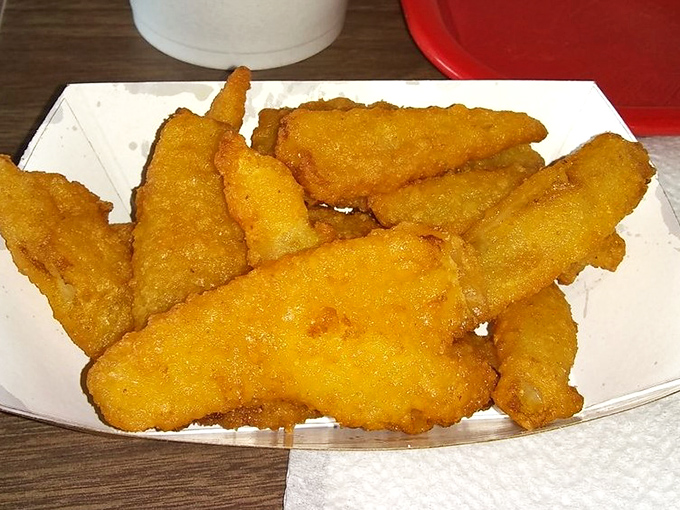 Crispy golden nuggets of joy. Not quite onion rings, not quite fries—these breaded morsels occupy that perfect middle ground of snackable satisfaction.