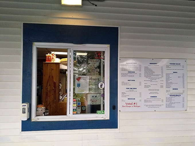 The window of opportunity – where dreams are ordered, anticipation builds, and the promise of burger bliss is just moments away.