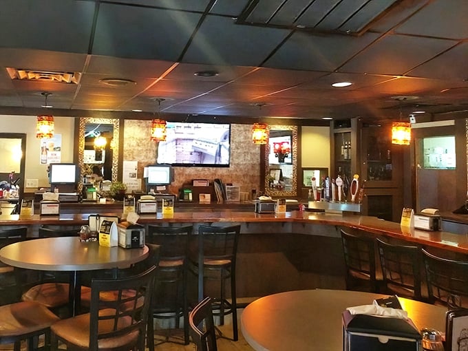 The bar area strikes that perfect balance between "neighborhood watering hole" and "family restaurant" – welcoming to all who enter its wood-paneled domain.