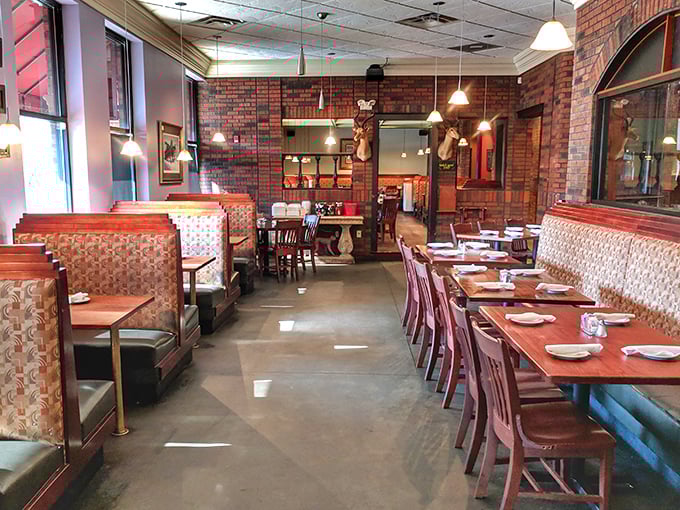 Exposed brick walls, comfortable booths, and thoughtfully arranged tables—the dining room feels like someone's dream home kitchen, just bigger and with better food.