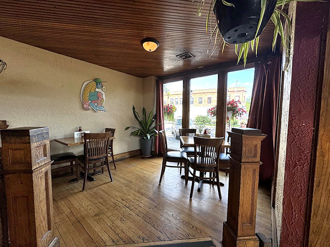Wooden pillars frame this sunny corner where coffee conversations stretch into lunch and sometimes—magically—into dinner plans.