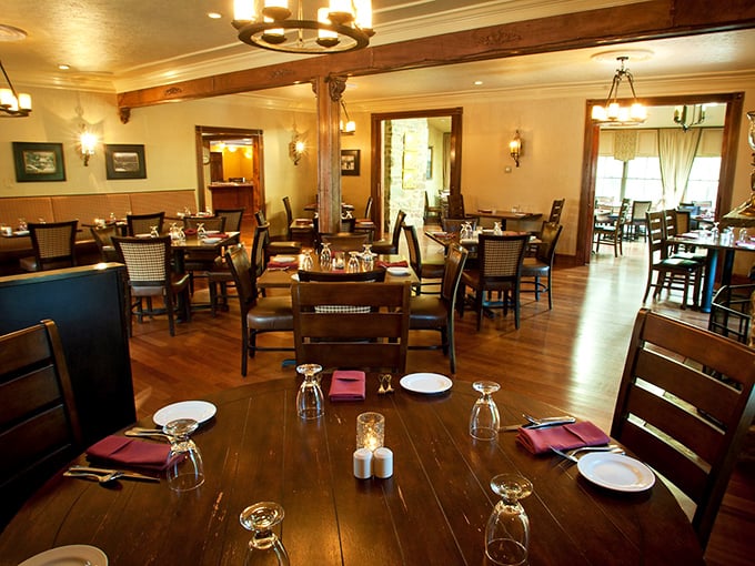 Warm wood tones, elegant place settings, and thoughtful lighting create the kind of dining room where memories are made between bites. 