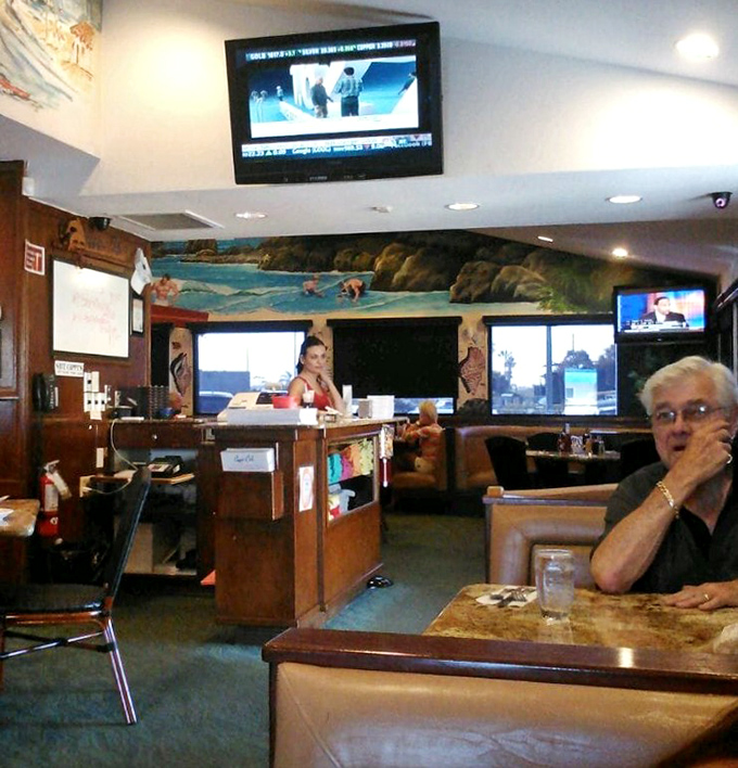 Another angle reveals more of Cappy's charm – where beach town casual meets family restaurant comfort in perfect harmony.