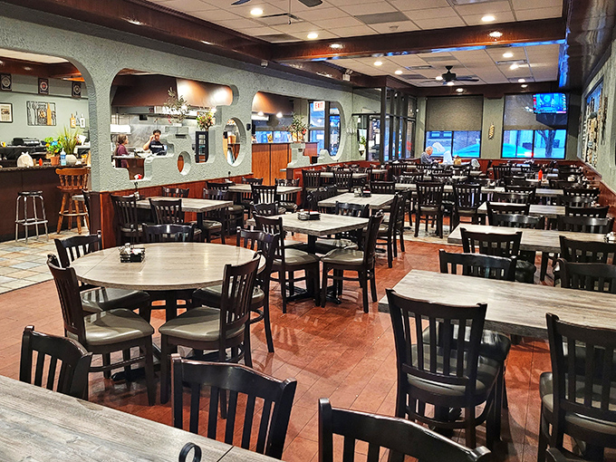 The spacious dining room buzzes with contentment as families gather around tables laden with Greek treasures.