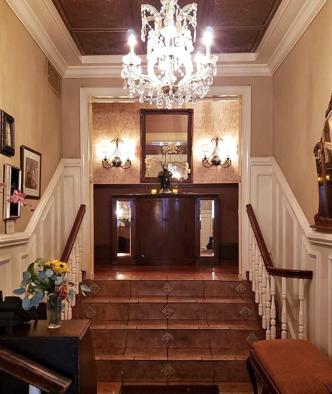 The elegant staircase and crystal chandelier suggest you're entering somewhere special – like the Italian embassy of deliciousness.
