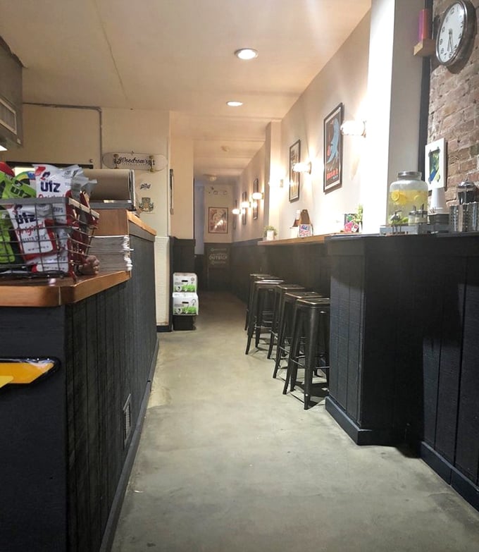 The narrow, cozy interior feels like a secret club where the membership fee is ordering something delicious.
