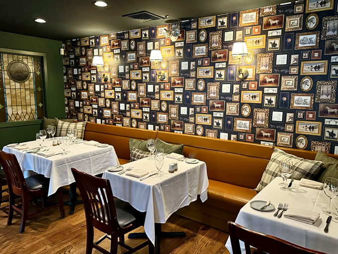 The frame-covered wall tells stories without saying a word—like dining inside a cozy, delicious museum of memories.