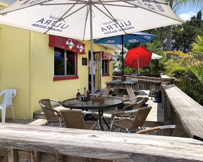 Florida dining at its most charming—umbrella-shaded outdoor tables where gentle breezes complement your coffee and conversation.