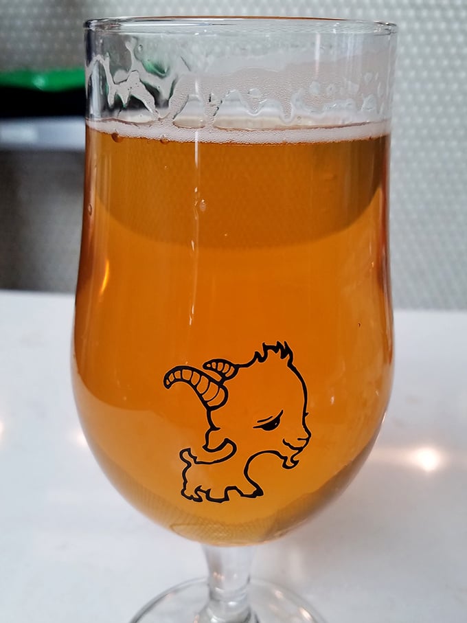 The house pale ale comes in a glass adorned with the restaurant's mascot—a reminder that breakfast pairs surprisingly well with beer.