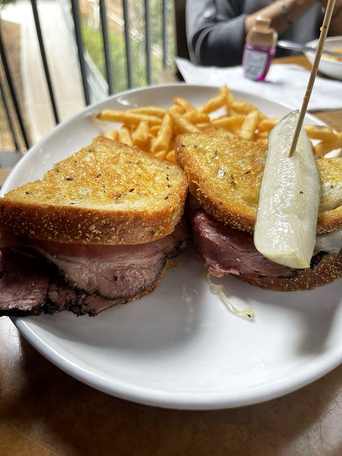 This pastrami sandwich deserves its own IMDb page—thick-sliced meat, golden-grilled bread, and a pickle spear that steals every scene it's in.