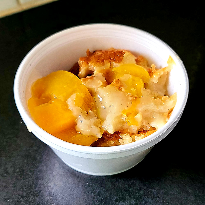 Peach cobbler that looks like summer decided to take up permanent residence in a cup. The perfect sweet finale to a smoky meal.