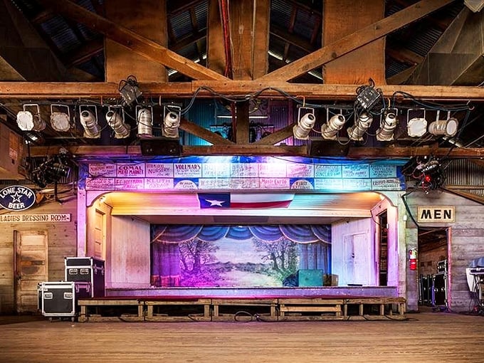 The stage awaits its next legend beneath the glow of colorful lights and the Texas flag—a humble platform that's launched countless careers.