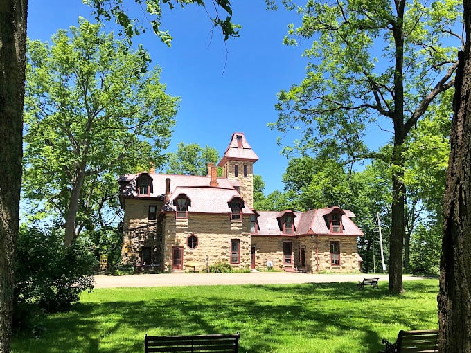 Piatt Castle emerges from the trees like something from a fairy tale, making you wonder if Ohio secretly has its own Downton Abbey.