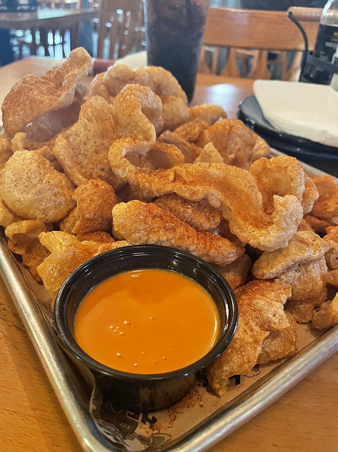 Pork rinds that shatter with each bite, paired with a cheese sauce so vibrant it practically glows in the dark. Keto dieters, rejoice!