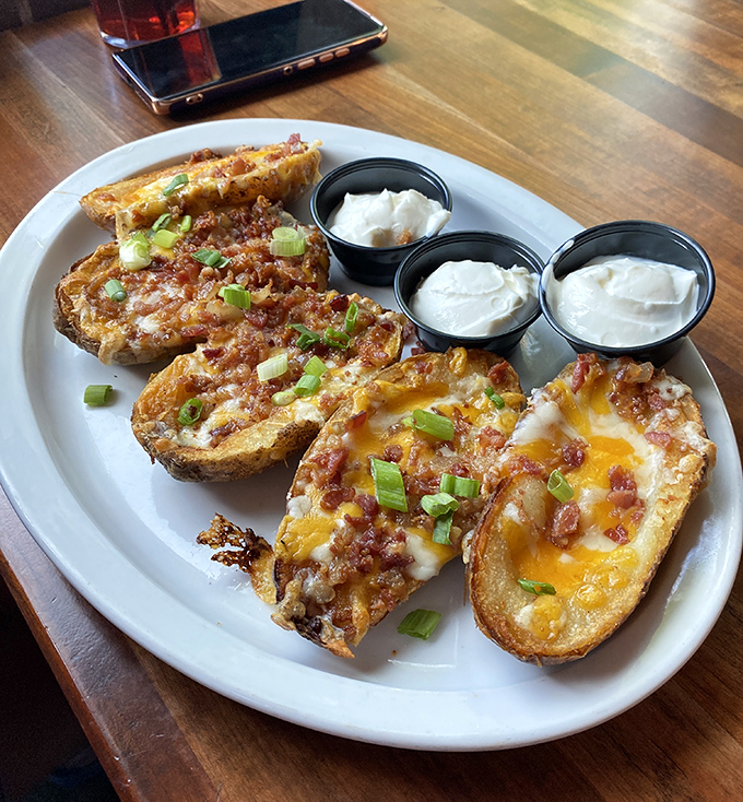 Potato skins loaded with enough toppings to make your cardiologist weep tears of joy.
