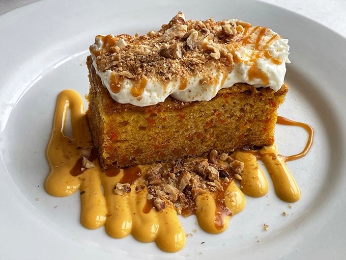 This isn't just pumpkin cake—it's autumn on a plate, with caramel drizzles and whipped cream that would make a pumpkin spice latte jealous.