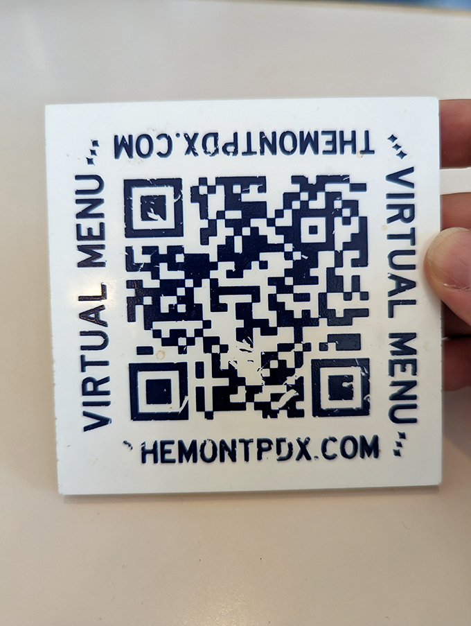 Even their QR code looks delicious—the modern equivalent of "Open Sesame" for a treasure cave of breakfast possibilities.