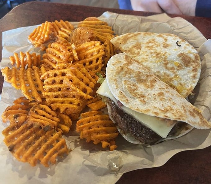Waffle fries and a quesadilla burger – proof that culinary fusion isn't just for fancy restaurants. This is what happens when good ideas meet hungry people.