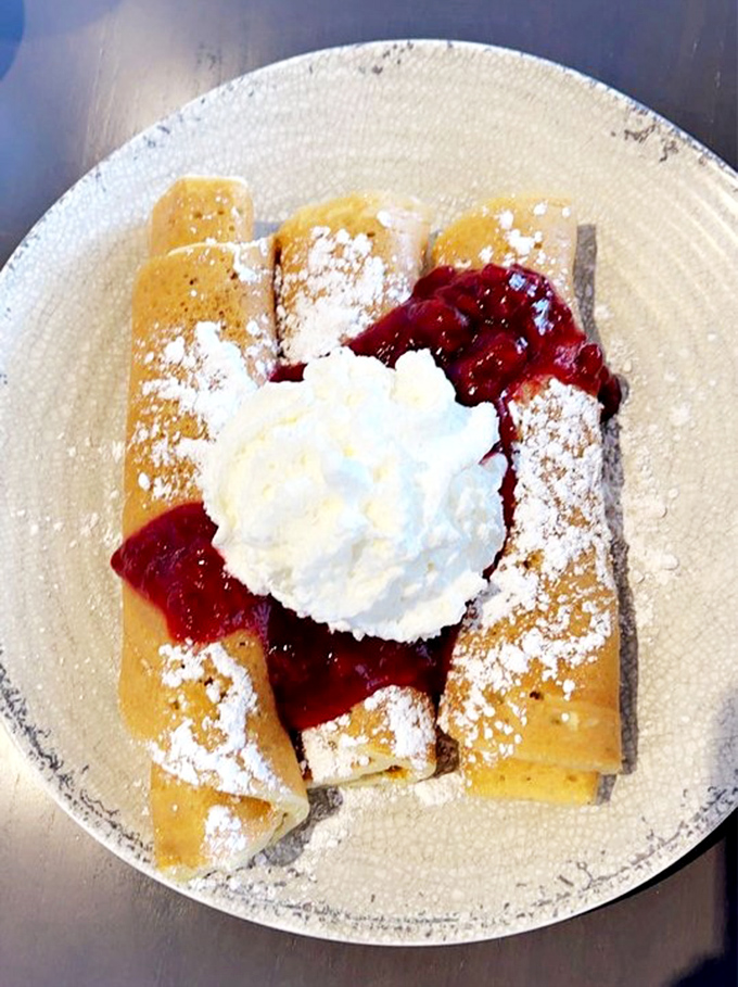 These rolled cakes aren't just dessert—they're edible architecture, supporting structures of whipped cream and berry compote with delicious integrity.