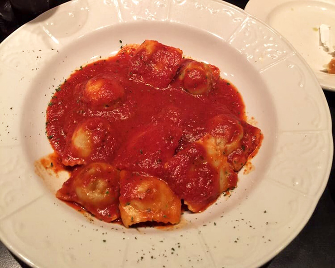 Ravioli swimming in marinara like little pasta pillows taking a delicious spa day – each bite a reminder of why Italian food conquered the world. 