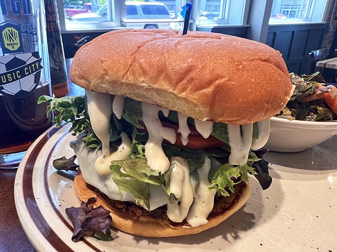 This isn't just a burger; it's a tower of indulgence where sauce cascades down like a waterfall of flavor, demanding both your attention and extra napkins.