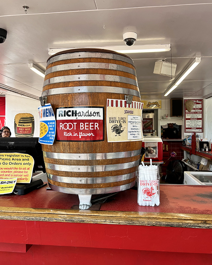The wooden barrel isn't just decoration—it's the heart of the operation, pumping liquid happiness into frosted mugs since before TikTok was a twinkle in anyone's eye.