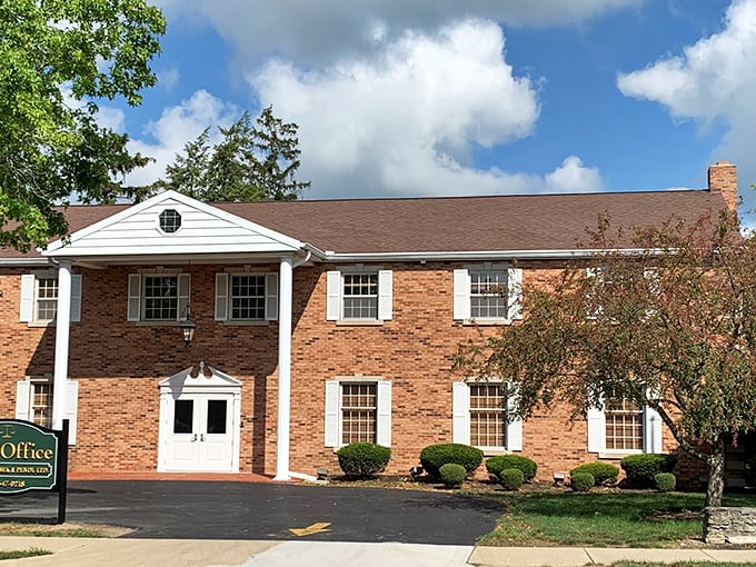 Classic brick colonial architecture houses modern businesses in Greenville, where yesterday's craftsmanship meets today's needs with timeless elegance.