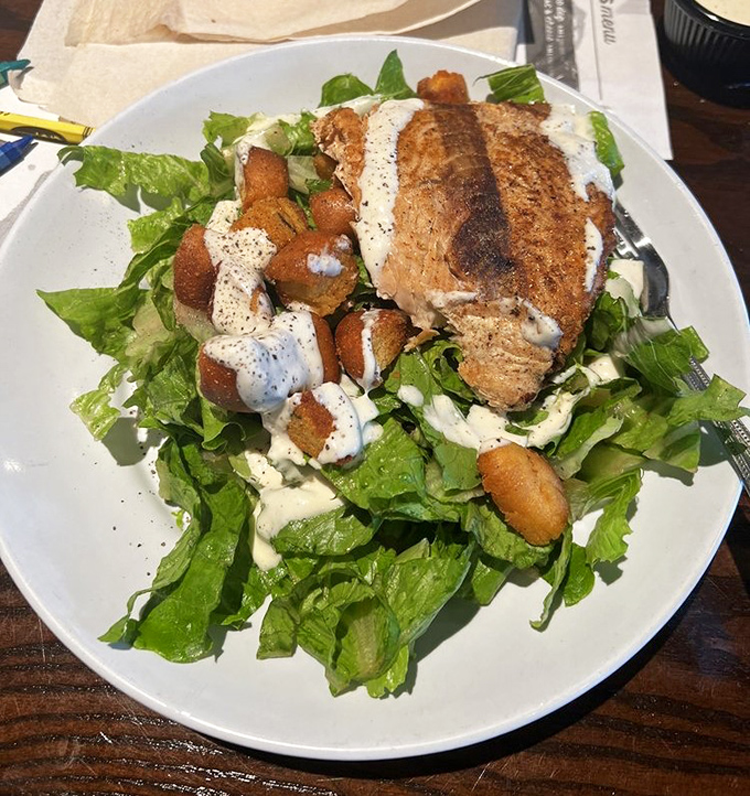Even salads get the royal treatment here—protein-packed and substantial enough to silence the voice saying you should've ordered a burger.