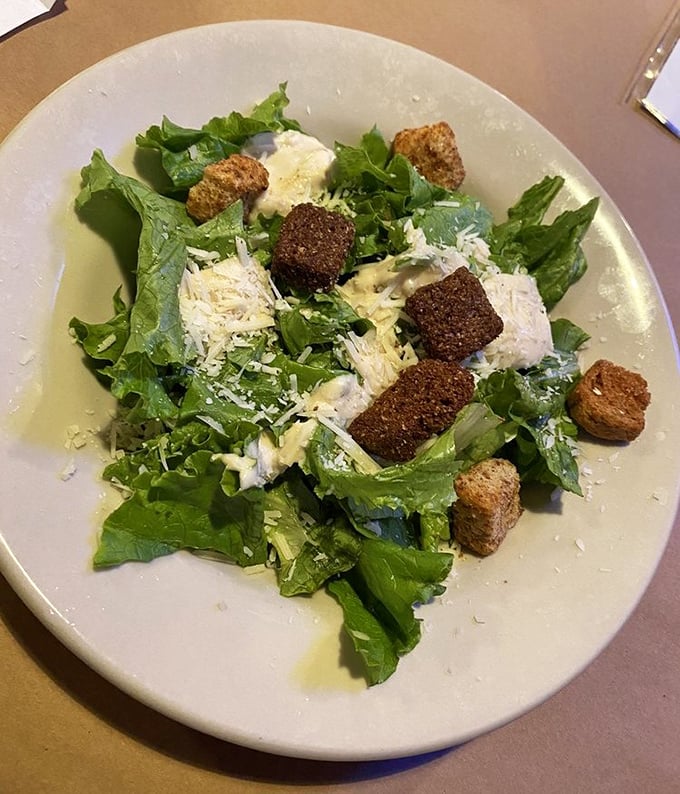 Even their salads mean business—fresh greens, house-made croutons, and enough cheese to remind you this is still comfort food.