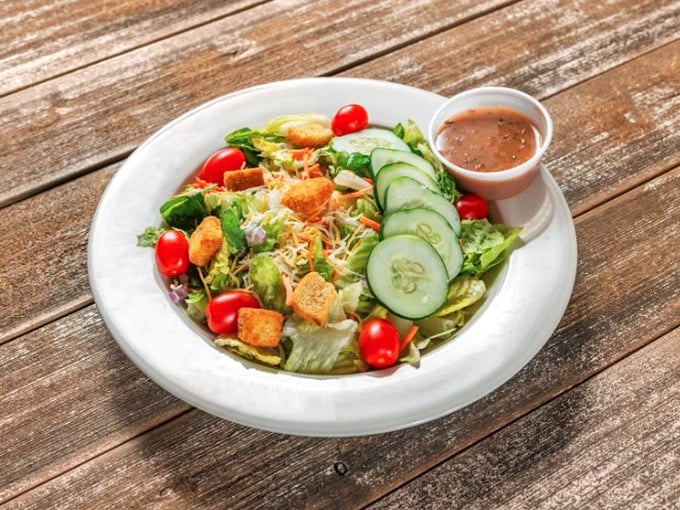 Even the salads get special treatment here – fresh, colorful, and proving that vegetables can hold their own at a barbecue joint.
