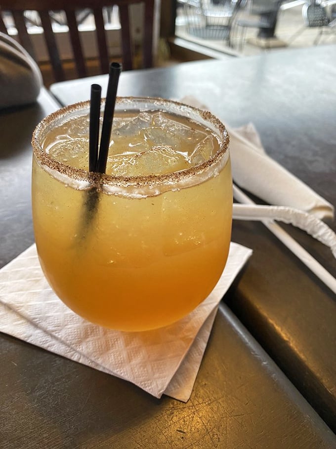 A cocktail that doesn't take itself too seriously. This sunset-colored concoction with its sugar rim promises refreshment with just enough kick to stand up to bold barbecue flavors.