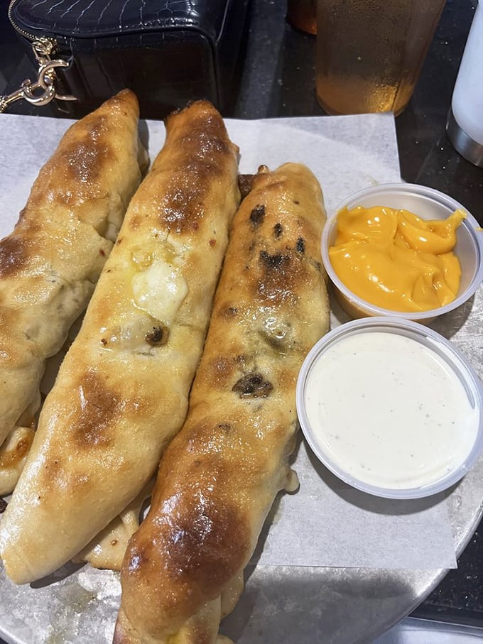These breadsticks with their golden-brown complexion aren't just stuffed—they're practically bursting with personality and cheese-pulling potential.