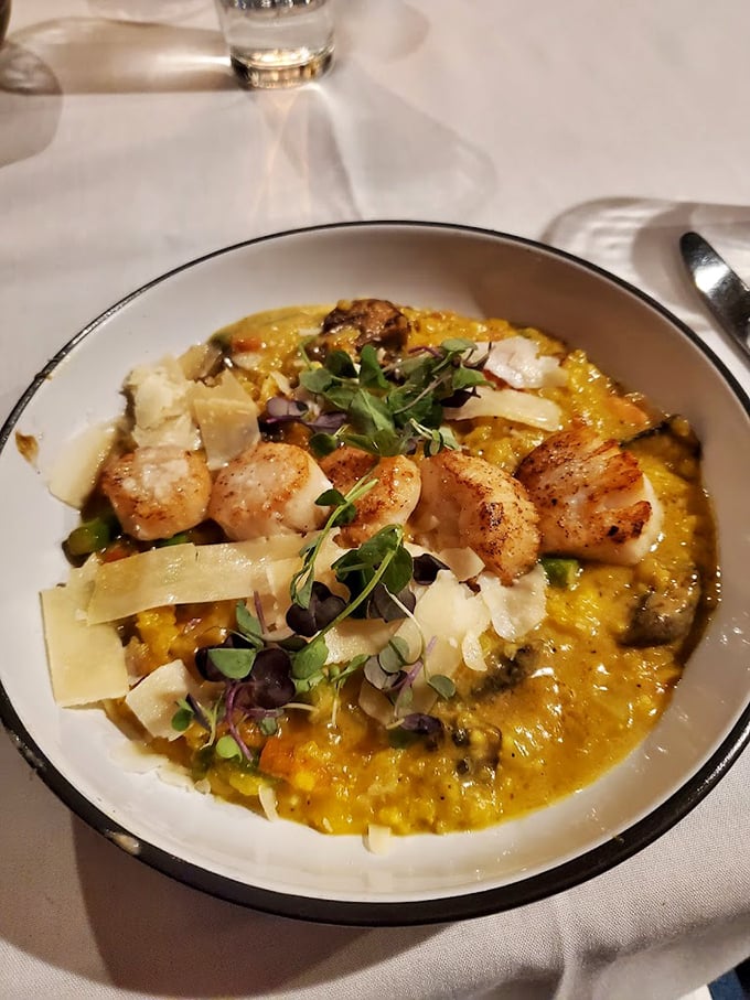 Scallops perched atop saffron risotto like perfectly seared sentinels guarding golden treasure. Worth every mile of your journey to Akron.