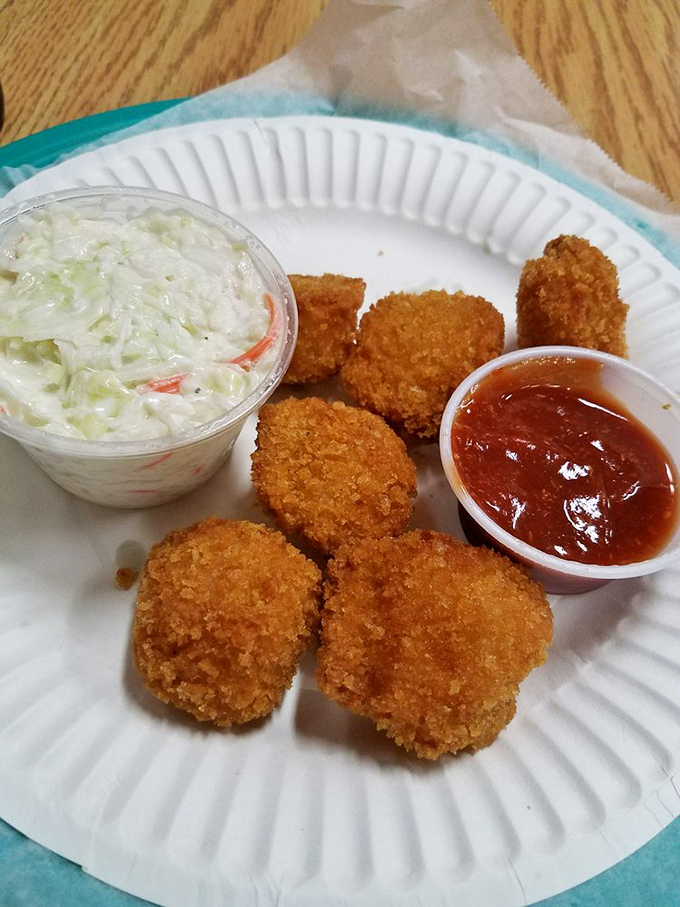 These aren't your average scallops—they're armor-plated ocean treasures. Crispy outside, tender inside, with coleslaw standing by for refreshment duty.