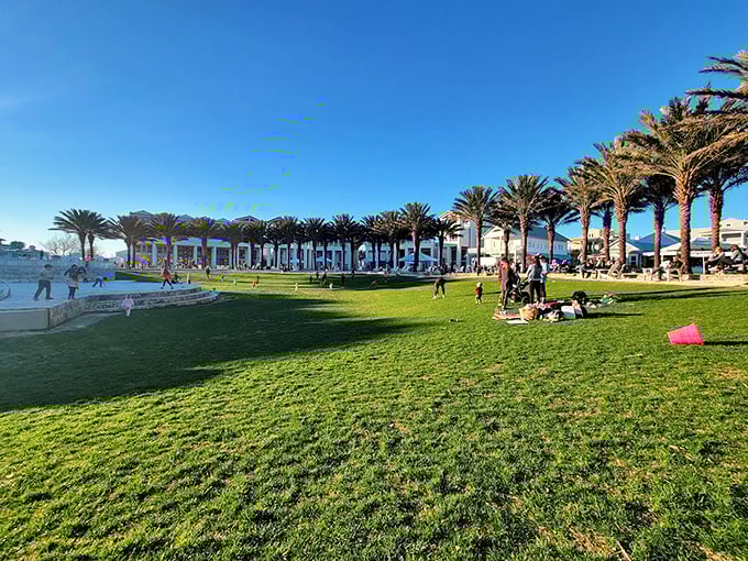 Seaside's central green space transforms into a community living room where locals and visitors alike gather to play, picnic, and pretend they live here year-round.