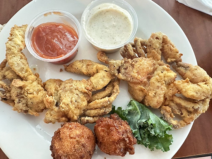 When soft-shell crabs and hushpuppies share a plate, it's like a Gulf Coast greatest hits album served on checkered paper.