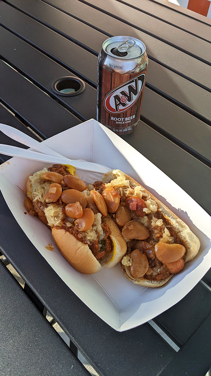 The legendary Squeeze Dog with A&W root beer—a pairing so perfect it should be taught in culinary schools. This isn't lunch; it's an American institution.