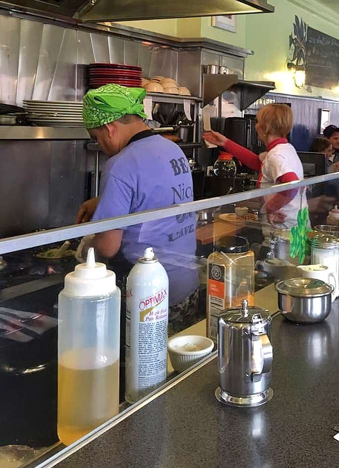 Behind the counter, the real magic happens – where skilled hands turn simple ingredients into morning masterpieces.