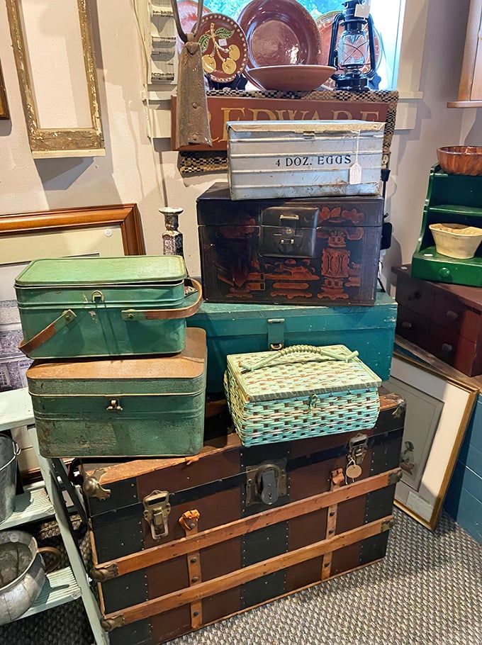 Stacked vintage trunks and picnic baskets—each one practically whispering tales of family road trips and lakeside lunches from decades past.