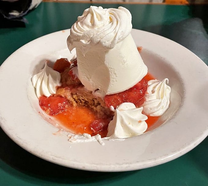 Strawberry shortcake reimagined as a summer dream. That ice cream melting into warm berries is nature's most perfect marriage.