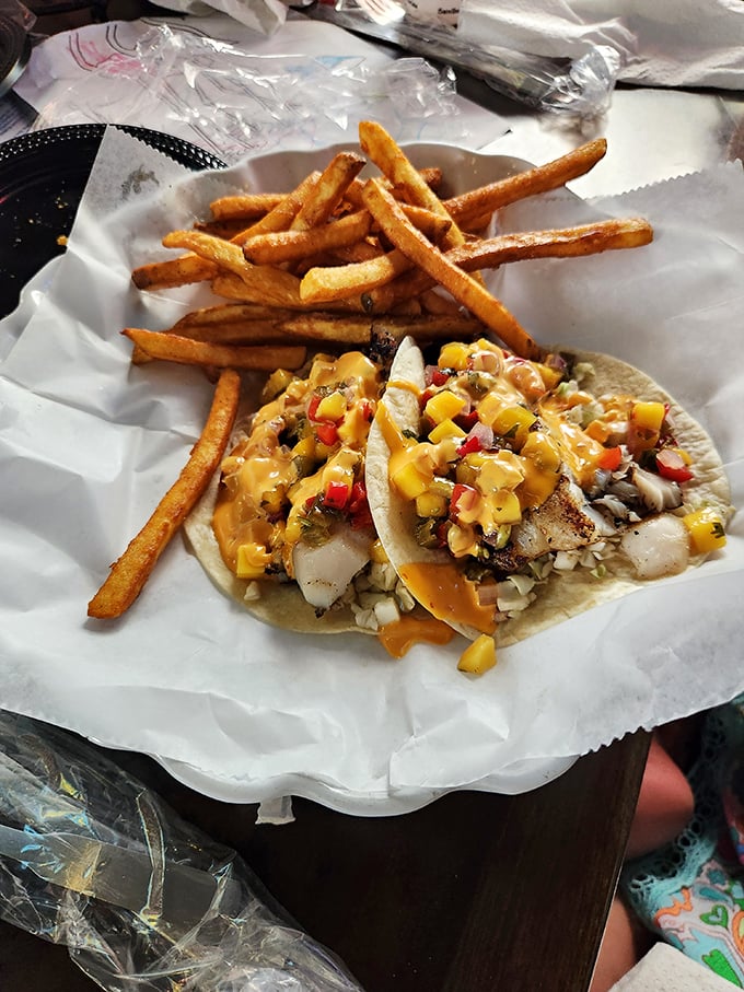 Fish tacos that tell a story of the sea in every bite. Those fries aren't sidekicks; they're co-stars in this culinary production.