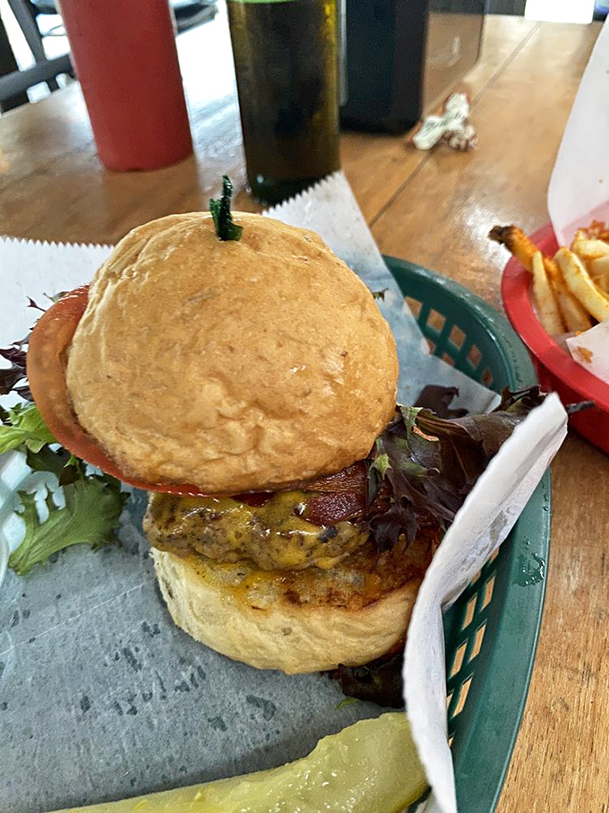 This isn't just a burger – it's a towering achievement of beef, bun, and toppings that requires jaw gymnastics and absolute focus.