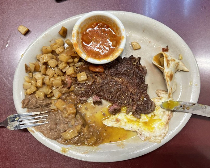 This Texas ribeye breakfast is what cowboys dream about – meat, eggs, and potatoes sharing a plate in perfect harmony, with salsa standing by for moral support.