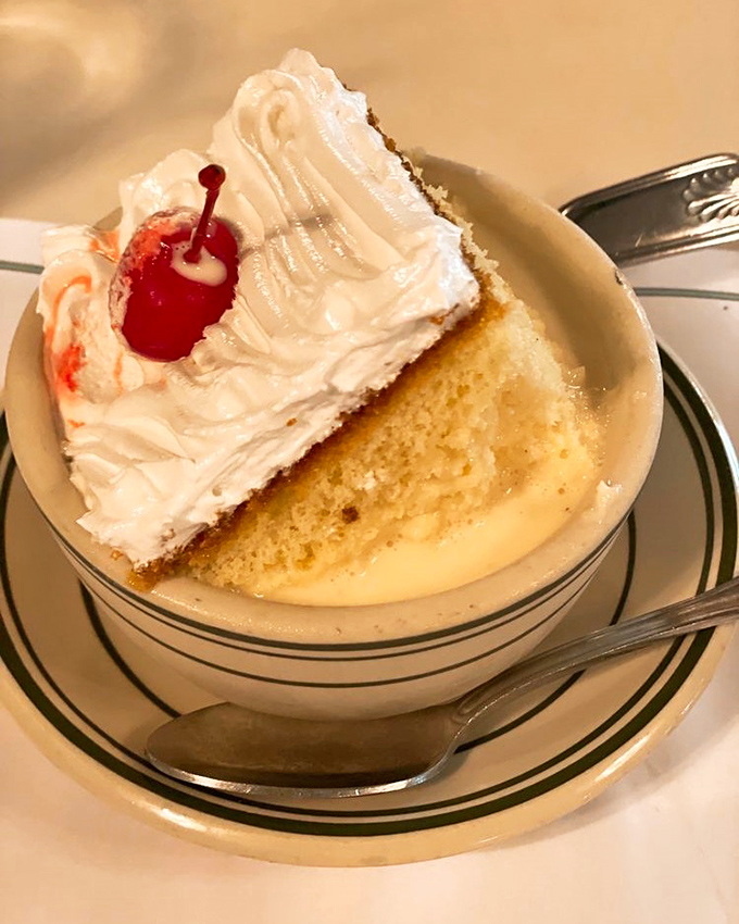 Three milk cake that floats like a cloud in a sweet pool of heaven – topped with a cherry that's purely ceremonial at this point.