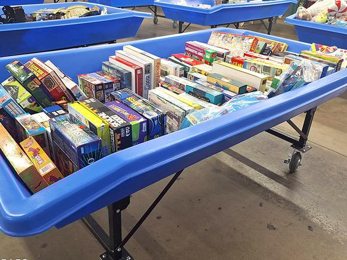 Board games, puzzles, and childhood nostalgia fill these blue bins – where memories are priced by the piece instead of by the gigabyte.