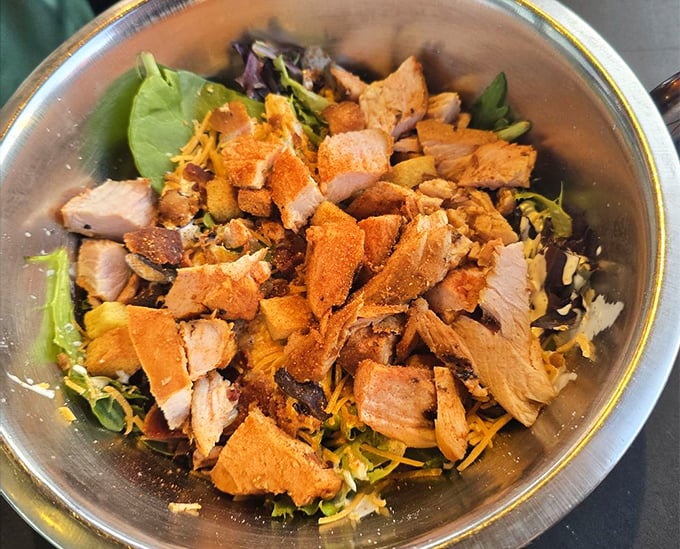 Even the salads get the smoke treatment – proof that eating greens doesn't mean missing out on barbecue's greatest hits.