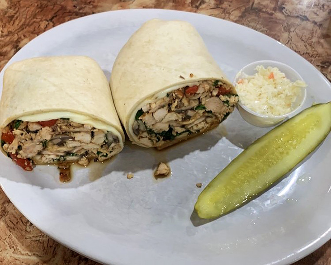 Not all heroes wear capes – some come wrapped in tortillas. This chicken-stuffed masterpiece delivers protein, veggies, and pure satisfaction in every bite.