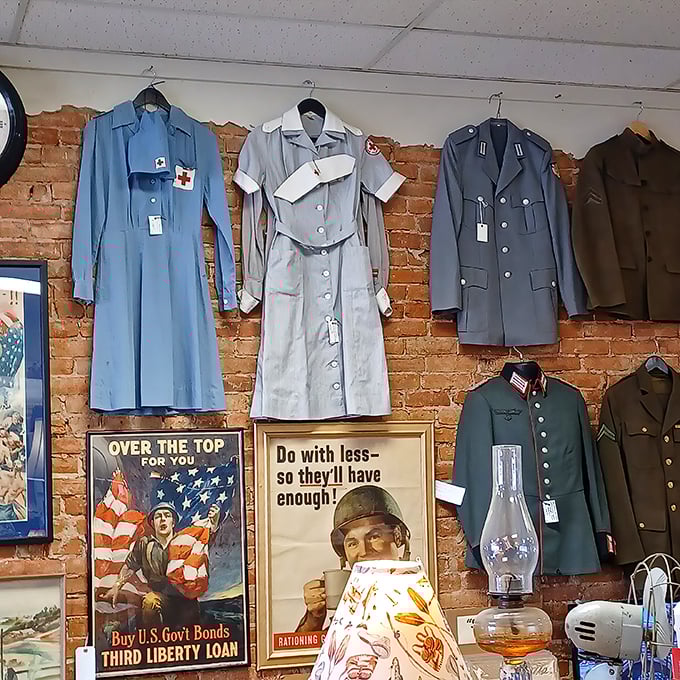 Military uniforms stand at attention alongside vintage war posters, silent witnesses to history that speak volumes about sacrifice and service.